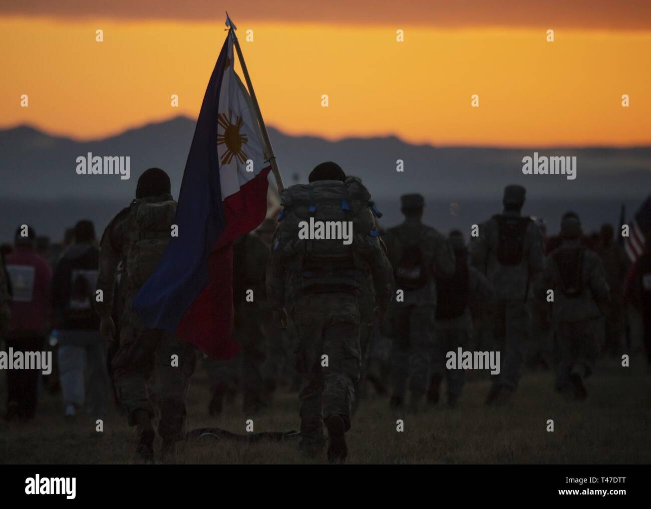 A participant of the 30th Annual Bataan Memorial Death March carries ...