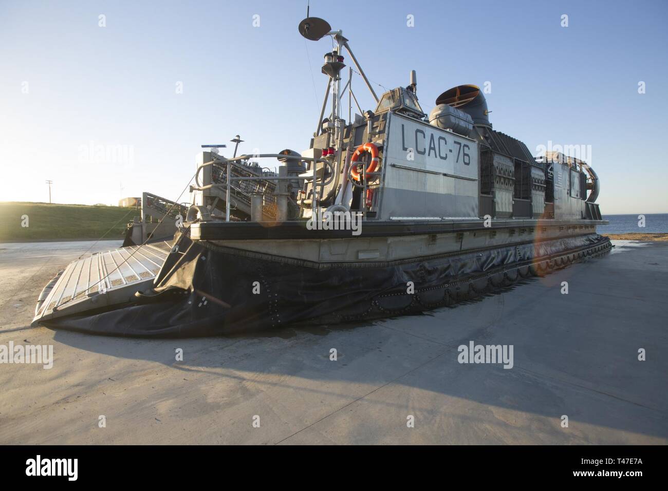 Landing Craft, Air Cushion (LCAC) 76 deflates to unload gear in support ...
