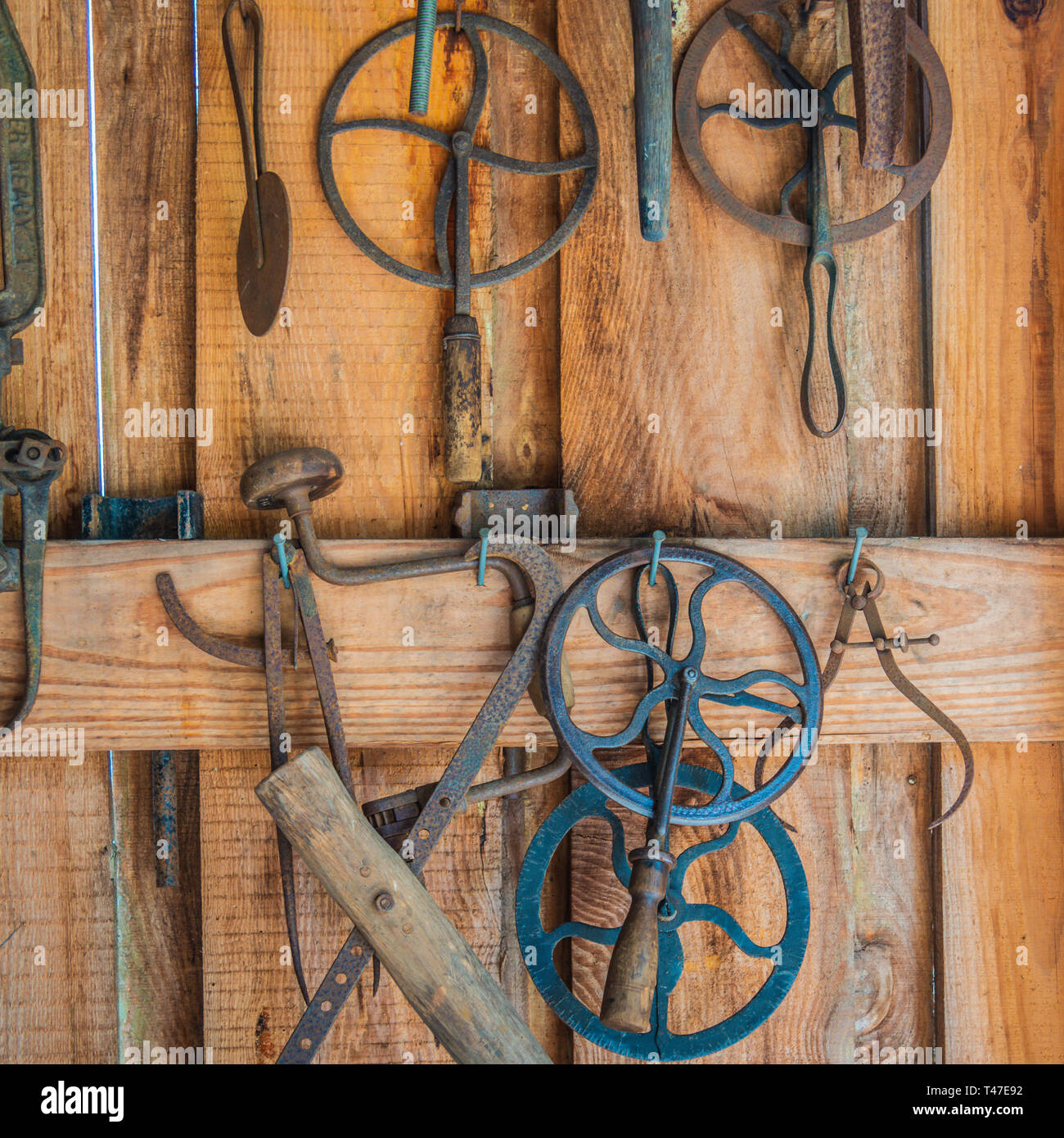 Antique Tools Hanging on Rustic Wooden Wall Stock Photo - Alamy