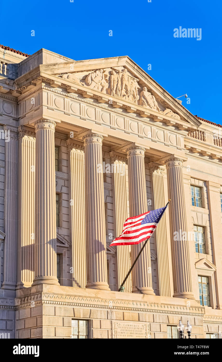 USA flag on facade of US Commerce building in Washington DC Stock Photo ...