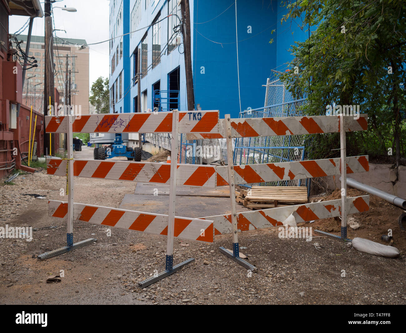 Construction barriers blocking an alley Stock Photo - Alamy
