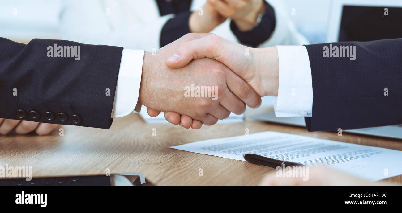 Business people shaking hands at meeting or negotiation in the office ...