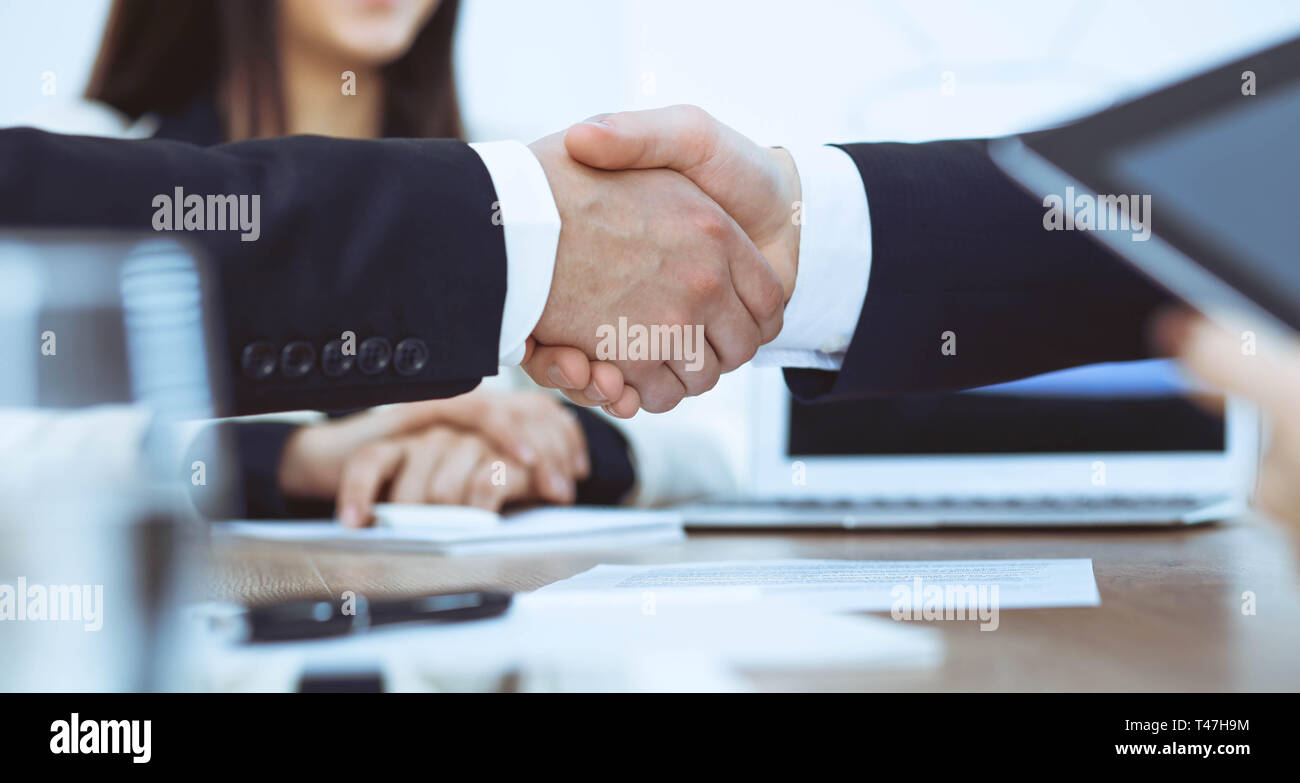Business people shaking hands at meeting or negotiation in the office ...