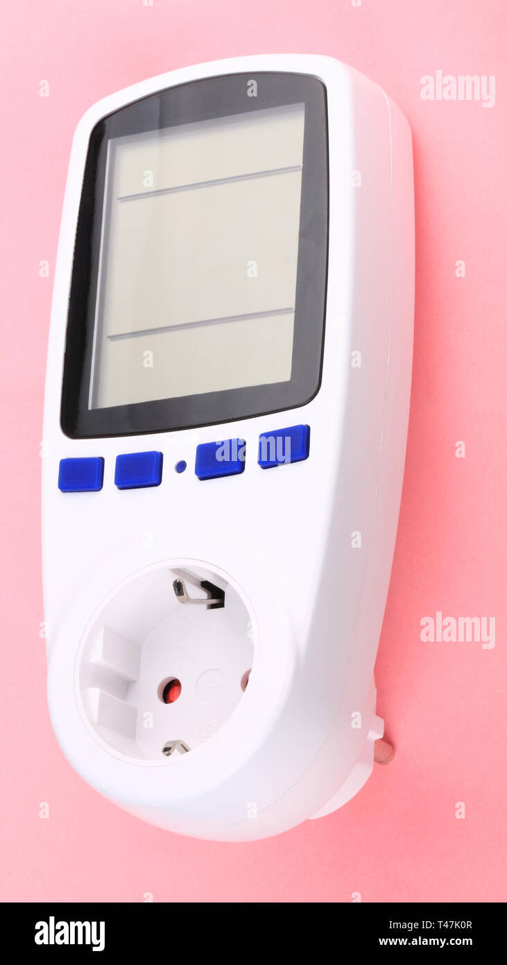 Digital Power Meter on pink background Stock Photo - Alamy