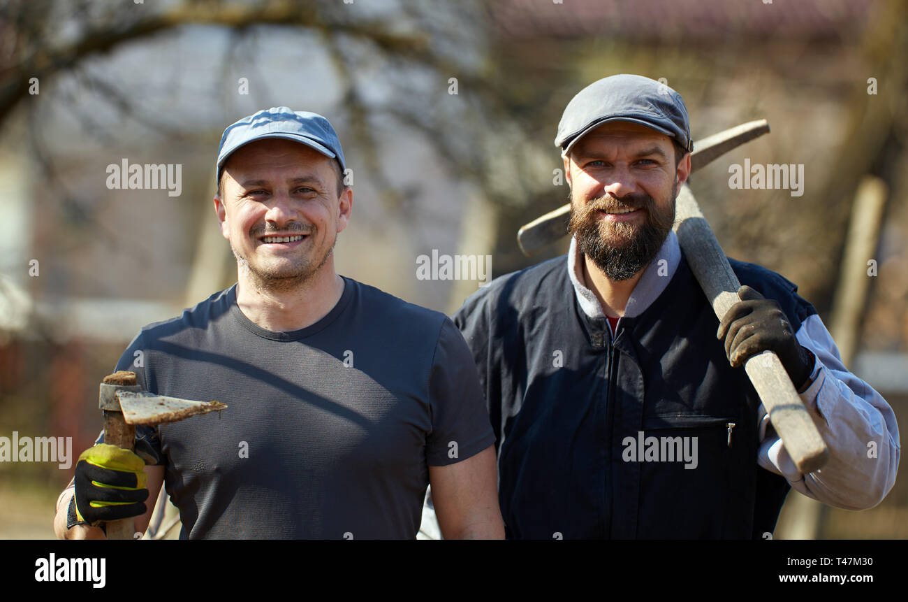Farmers with tools for planting trees Stock Photo - Alamy