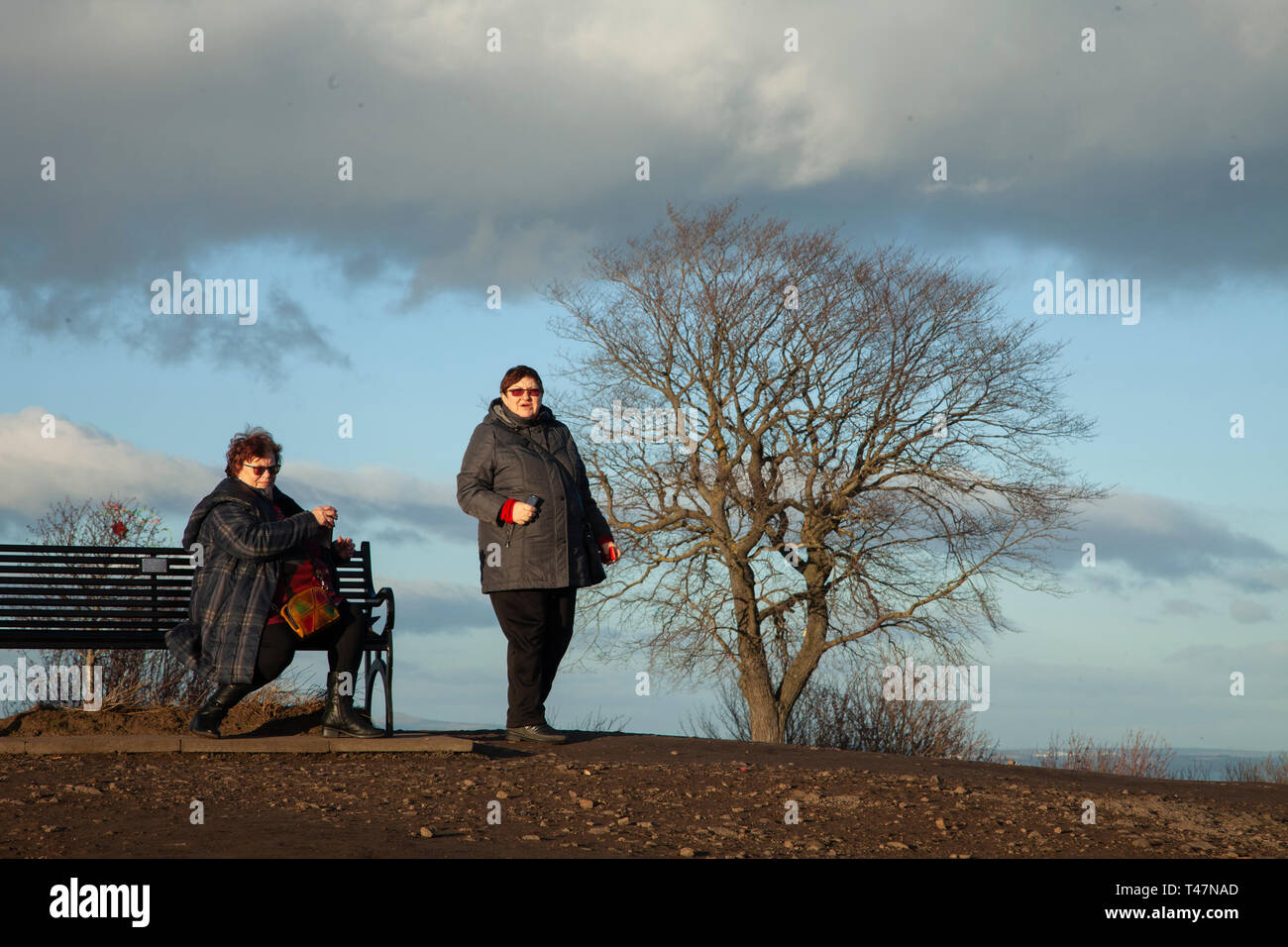 People enjoying nice sunny weather over the Calton Hill, Edinburgh ...
