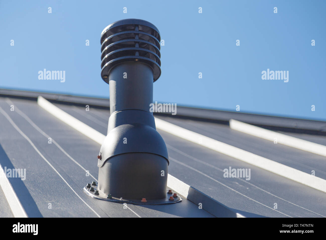 Exhaust pipe on the private house roof Stock Photo - Alamy