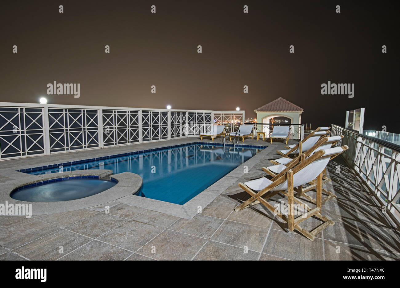 Swimming pool outside night railing hi-res stock photography and images ...