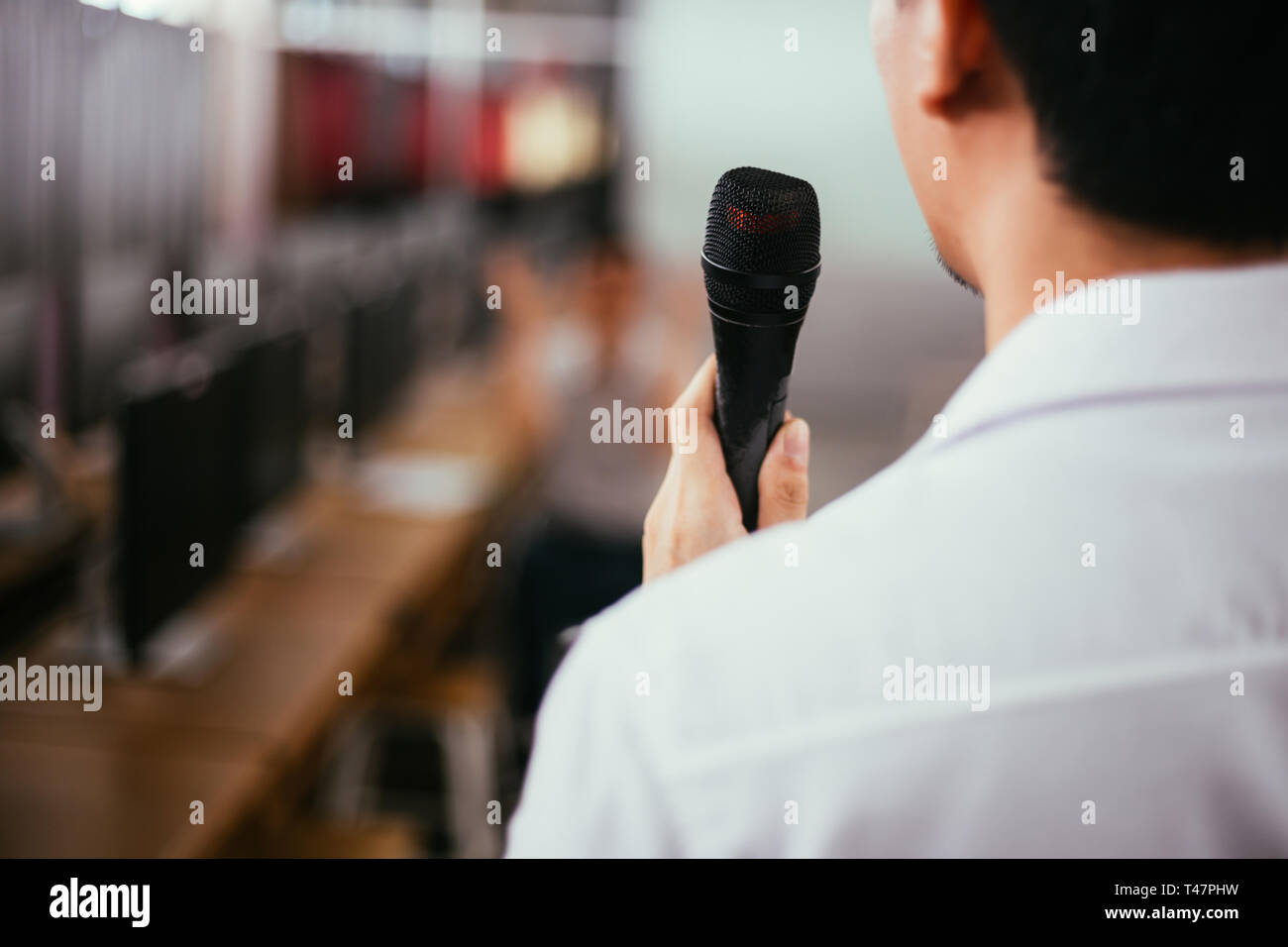 Close up of rear male businessman speaking and making a lecture in ...