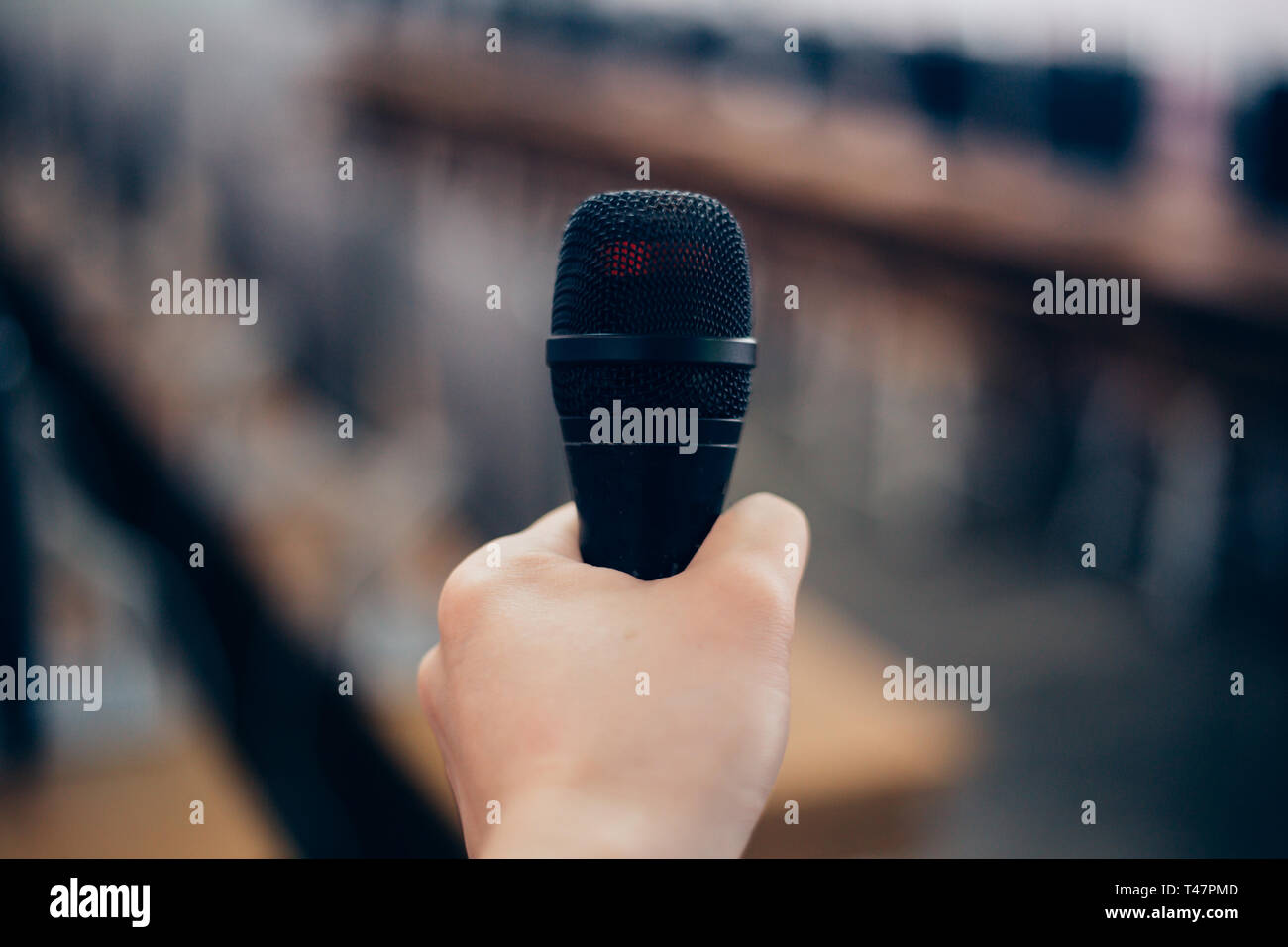 Holding mic with both hands hi-res stock photography and images - Alamy