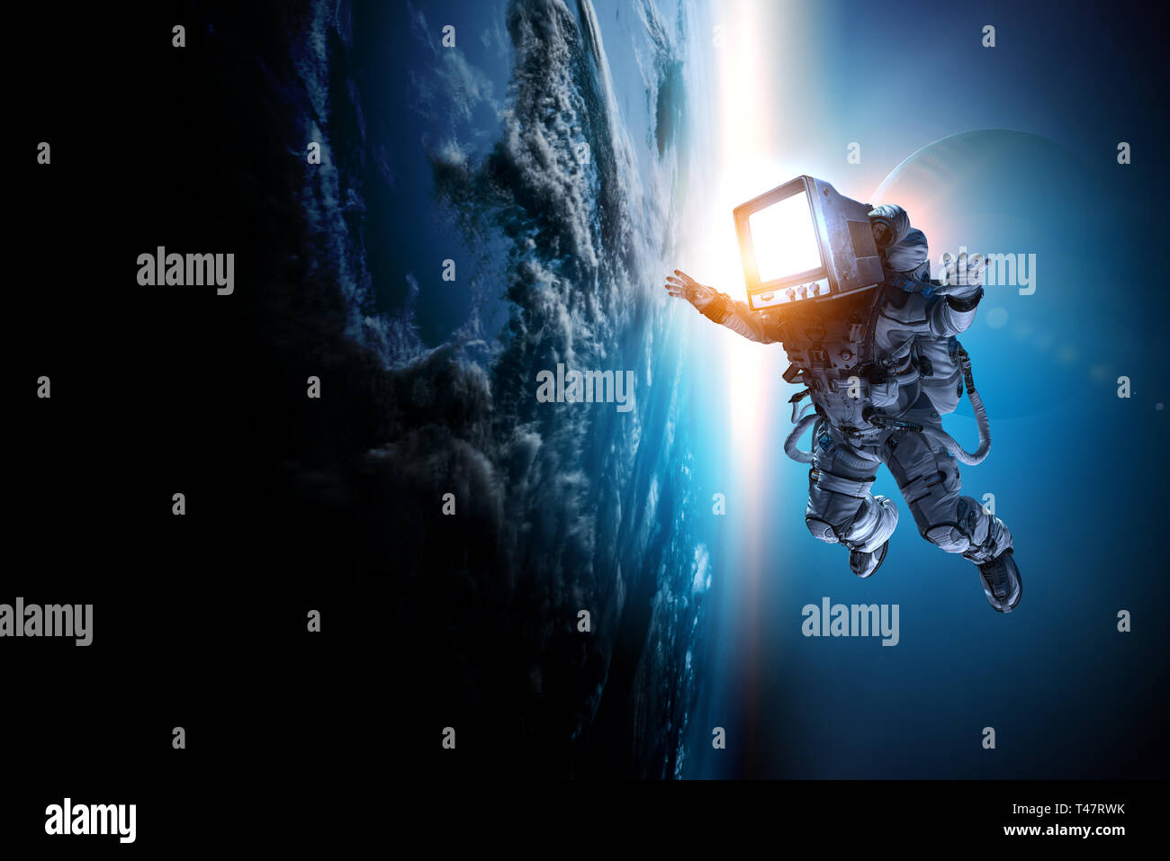 Astronaut with TV head in space. Mixed media Stock Photo - Alamy