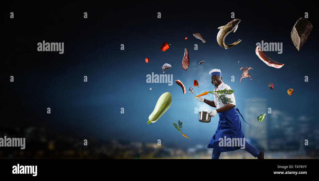 Man wearing apron cooking hi-res stock photography and images - Alamy