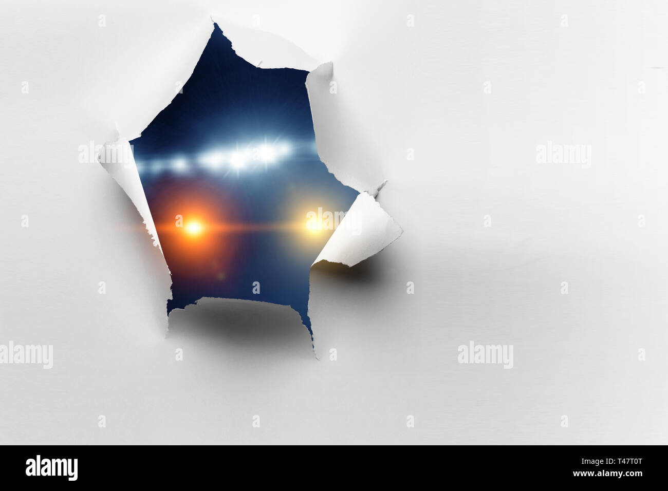 Paper torn hole effect with stadium view Stock Photo - Alamy