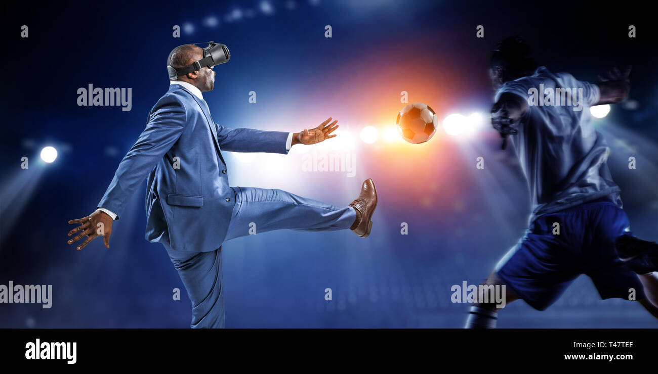 Black businessman on virtual reality football match Stock Photo - Alamy