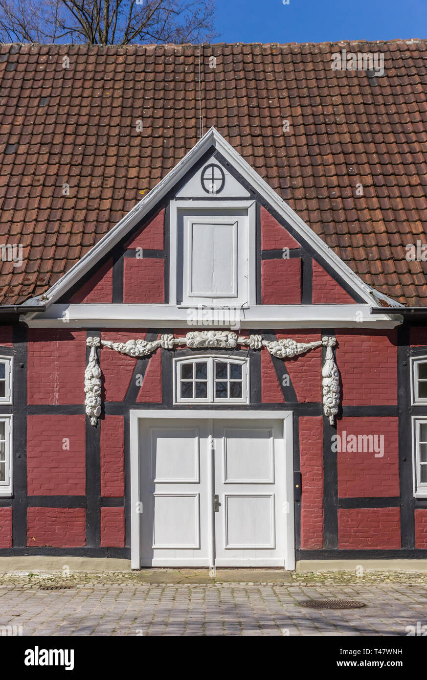 Entrance to red half timbered house in the castle park in Rheda ...