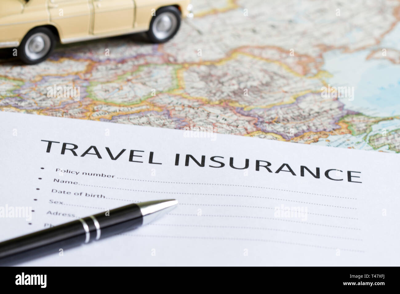Travel insurance concept with car and map Stock Photo - Alamy