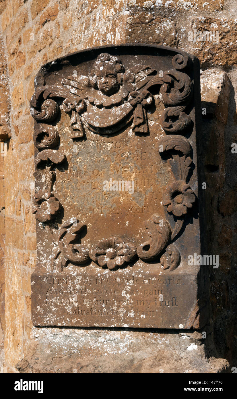 A memorial tablet on the outside of St. John the Baptist Church ...
