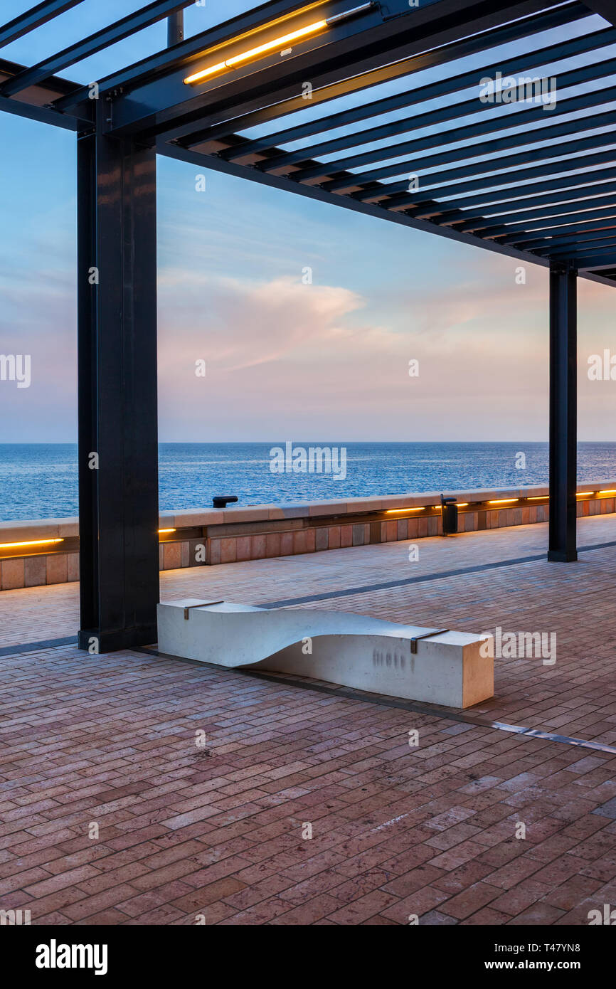 Sea promenade at dusk with pergola and bench in Monaco, Europe Stock ...