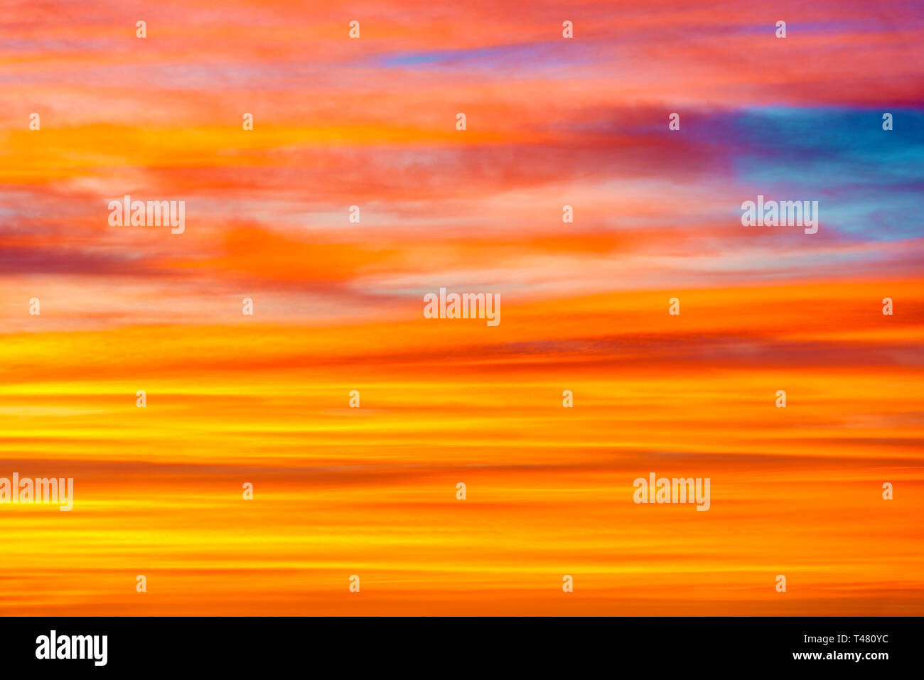 Colorful yellow, orange, red and blue sky background Stock Photo - Alamy
