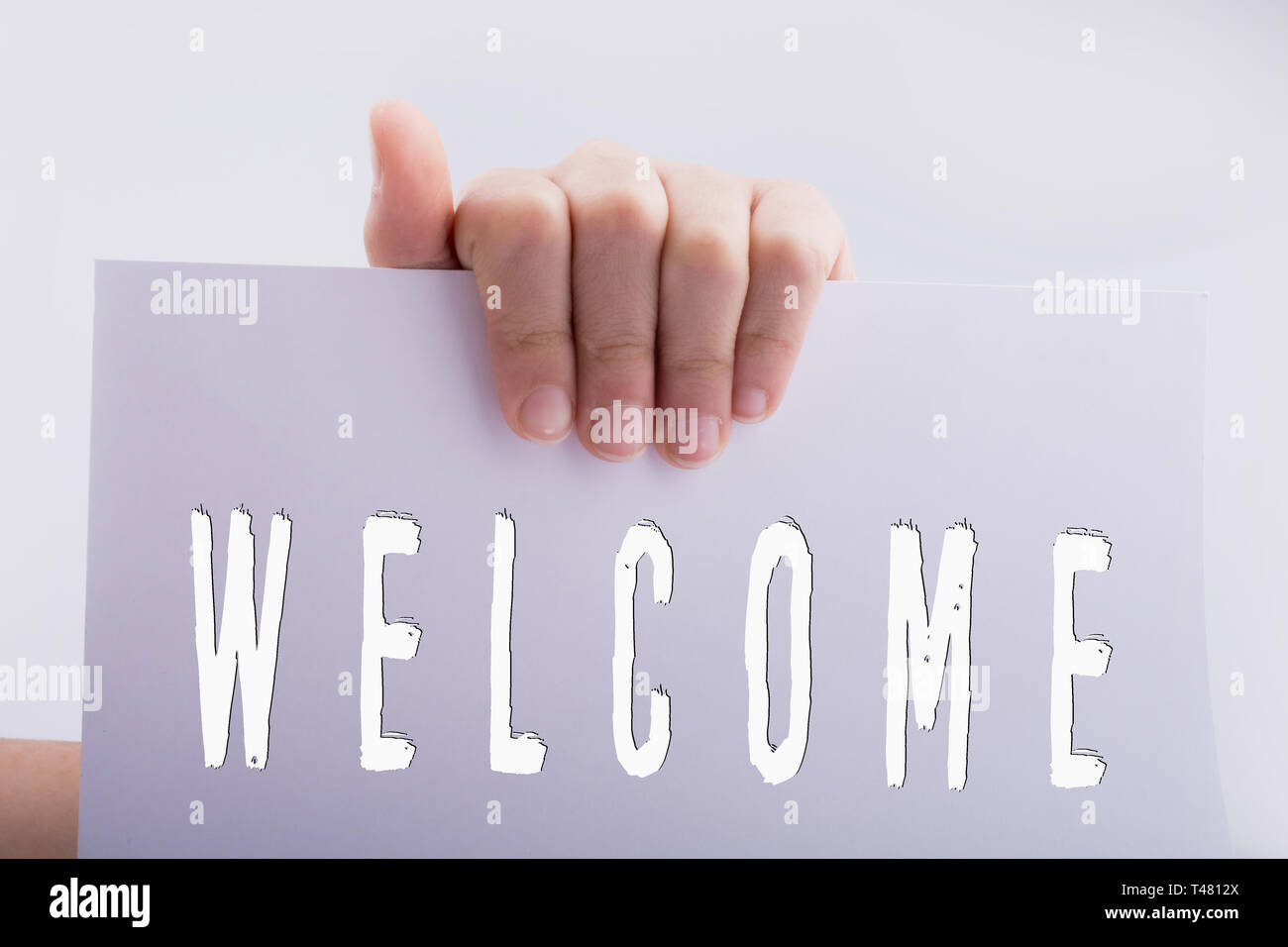 Hand holding welcome word on a white background Stock Photo - Alamy
