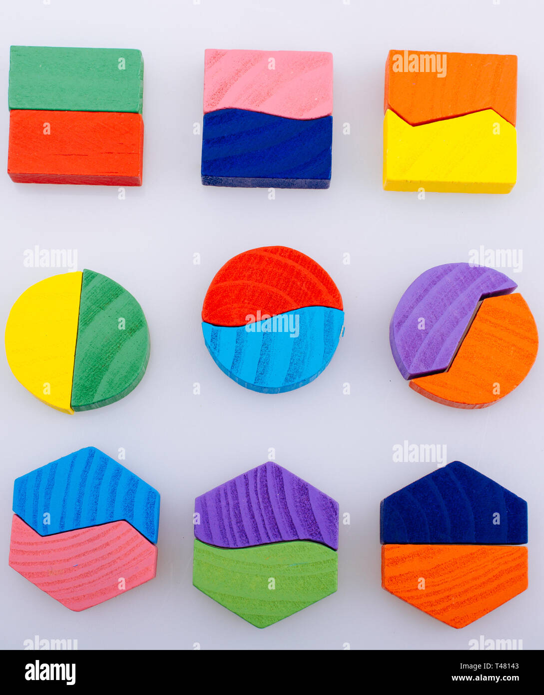 Colorful wooden pieces of a logic puzzle Stock Photo - Alamy