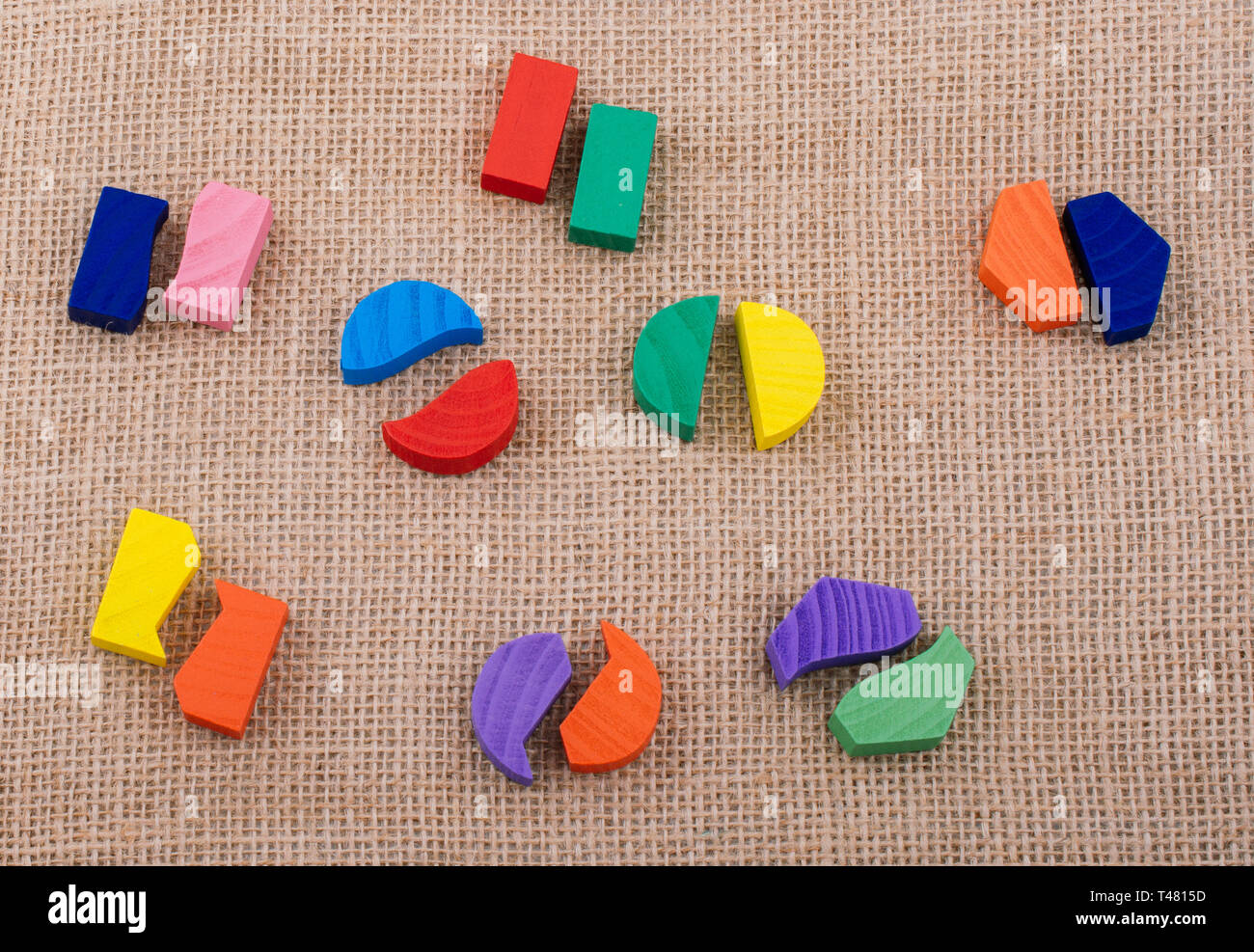 Colorful wooden pieces of a logic puzzle Stock Photo - Alamy