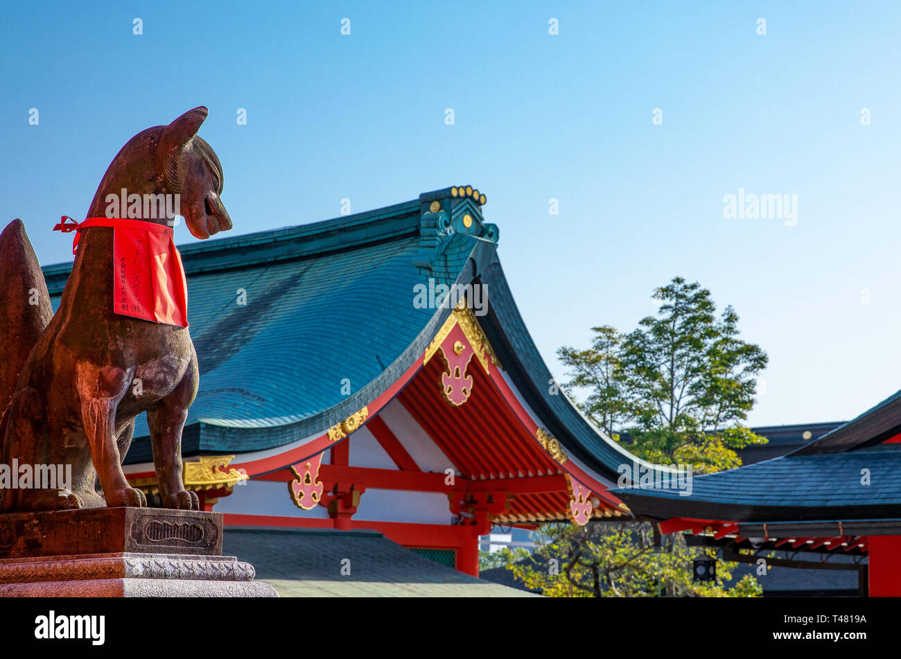 Kyoto, Japan - April 20, 2018: The sacred statue of a wolf in front of ...