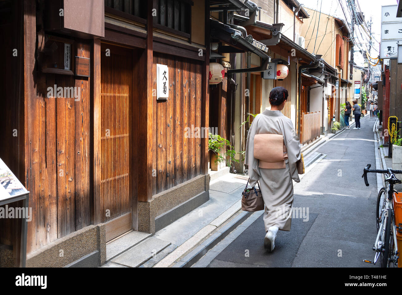 Kyoto, Japan - June 12, 2017: A lady in traditional kimono walking in a ...