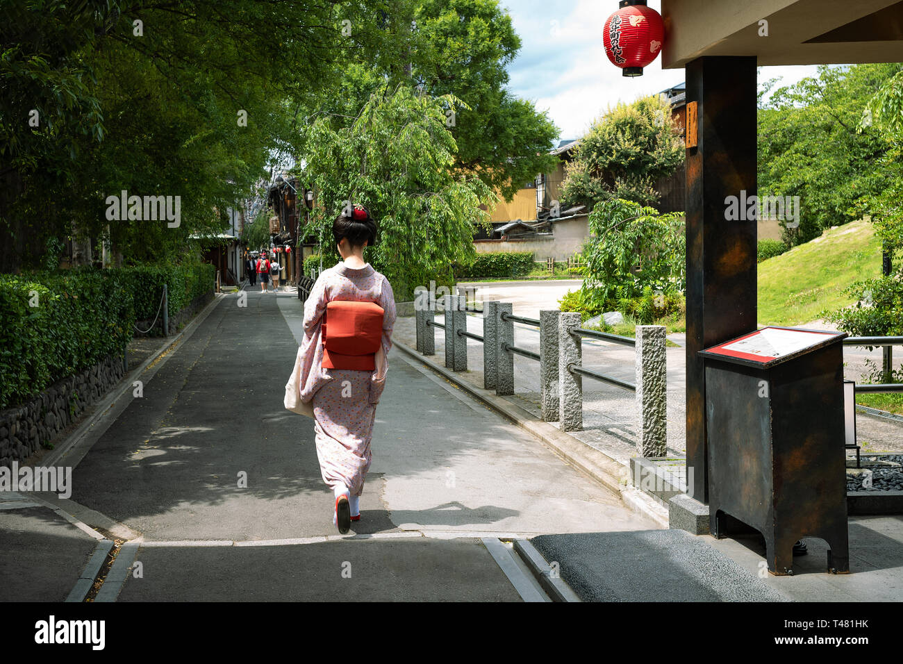 Kyoto, Japan - June 12, 2017: A lady in traditional kimono walking in a ...