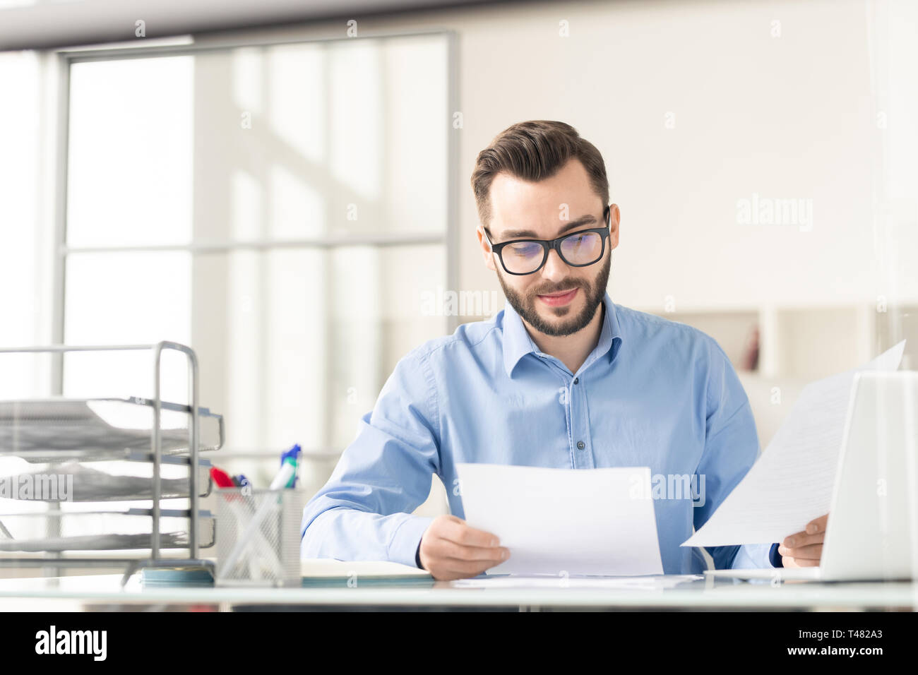 Agent with papers Stock Photo - Alamy