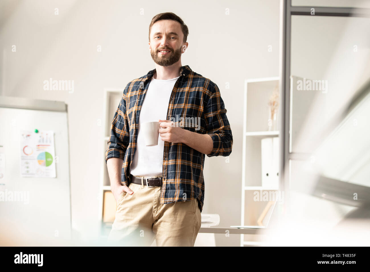 Having tea in office Stock Photo - Alamy