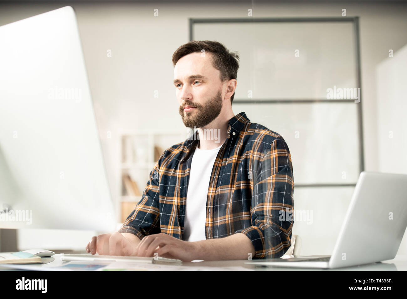 Man in front of computer Stock Photo - Alamy