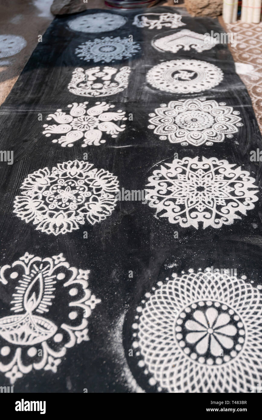 Vertical view of rangoli patterns on the roadside in India Stock Photo ...