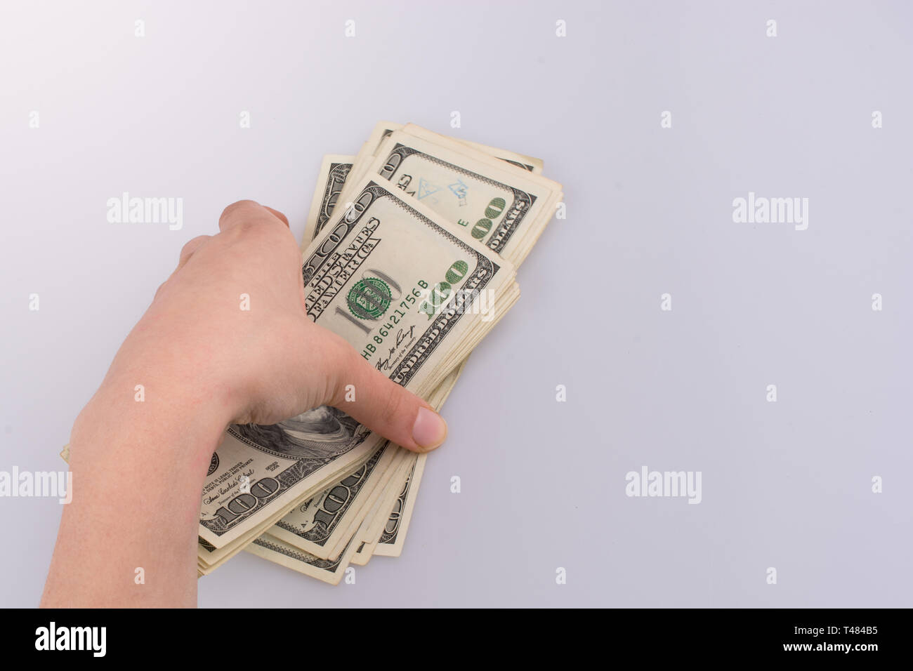 Human hand holding American dollar bill as money isolated on white ...