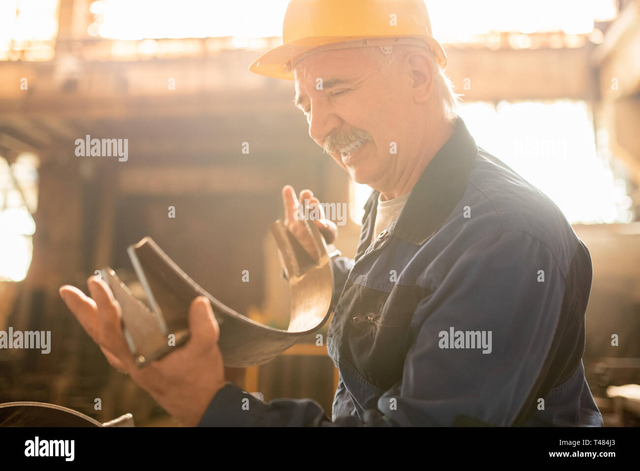 Engineer with workpiece Stock Photo - Alamy
