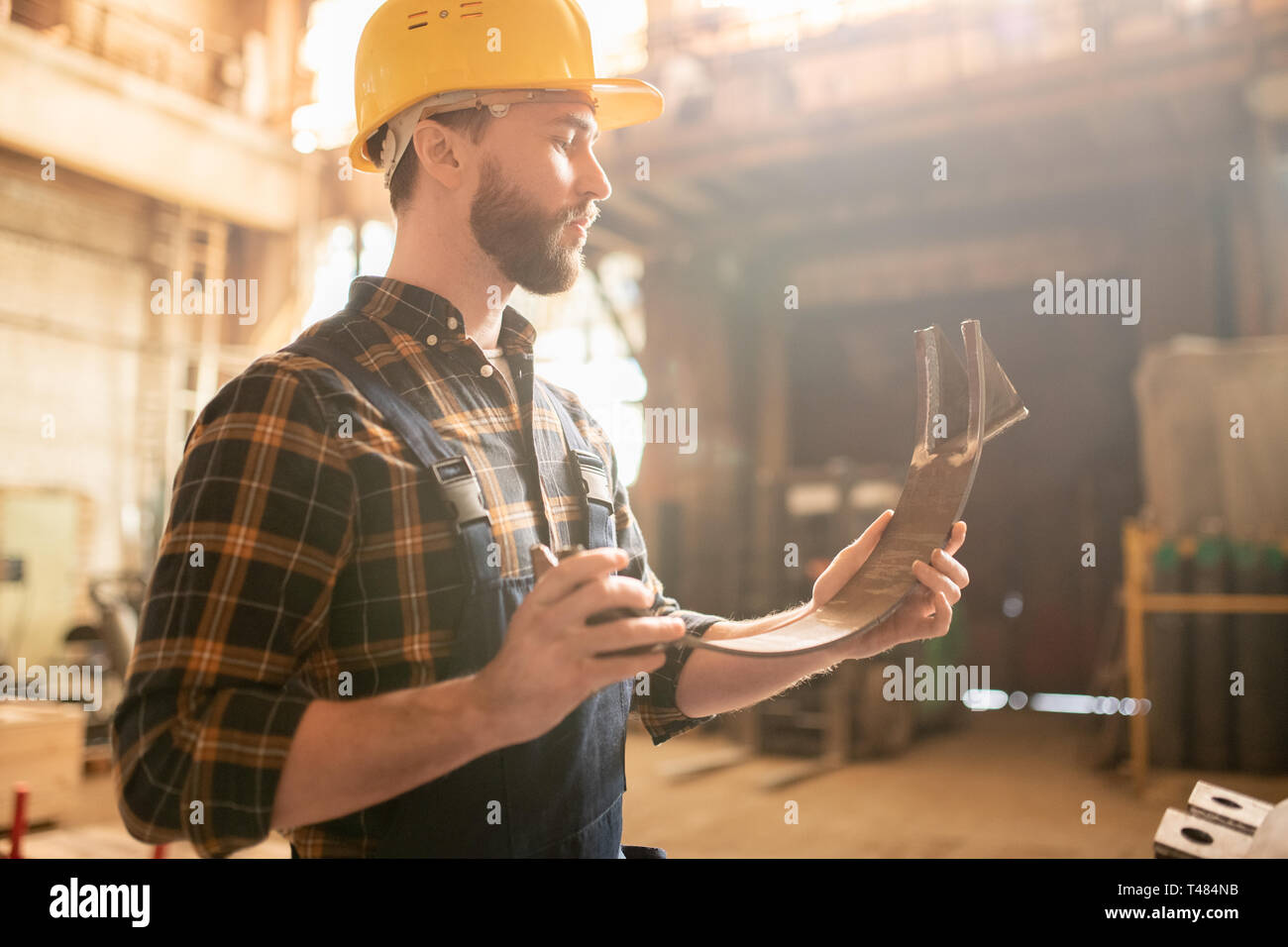 Man with workpiece Stock Photo - Alamy