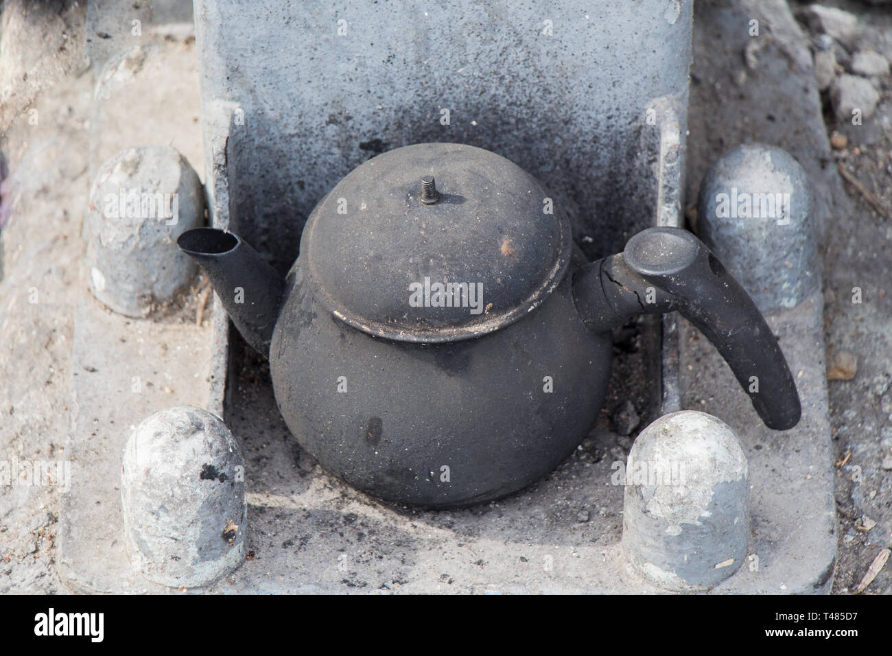Very old and rusty metal tea pot in the view Stock Photo - Alamy