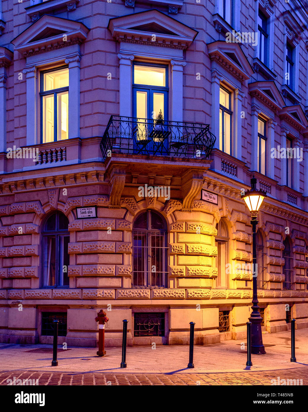 A city corner in the evening with a street lamp Stock Photo - Alamy