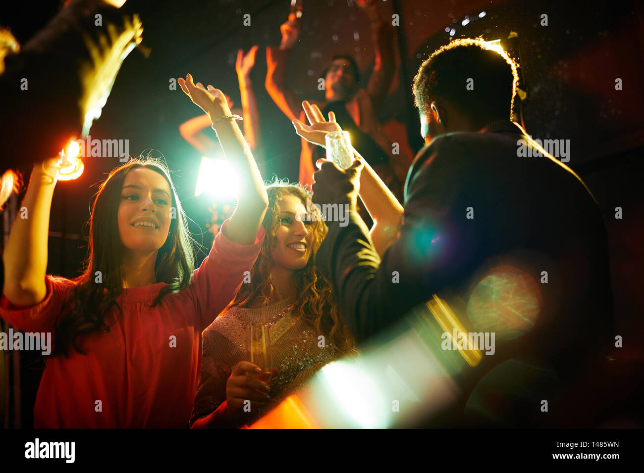Beautiful girls dancing at party Stock Photo - Alamy