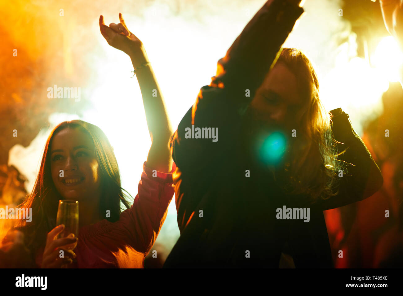 Energetic people dancing in smoke Stock Photo - Alamy