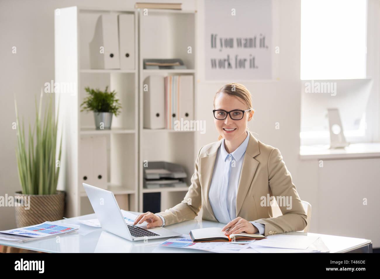 Modern office lady in office Stock Photo - Alamy