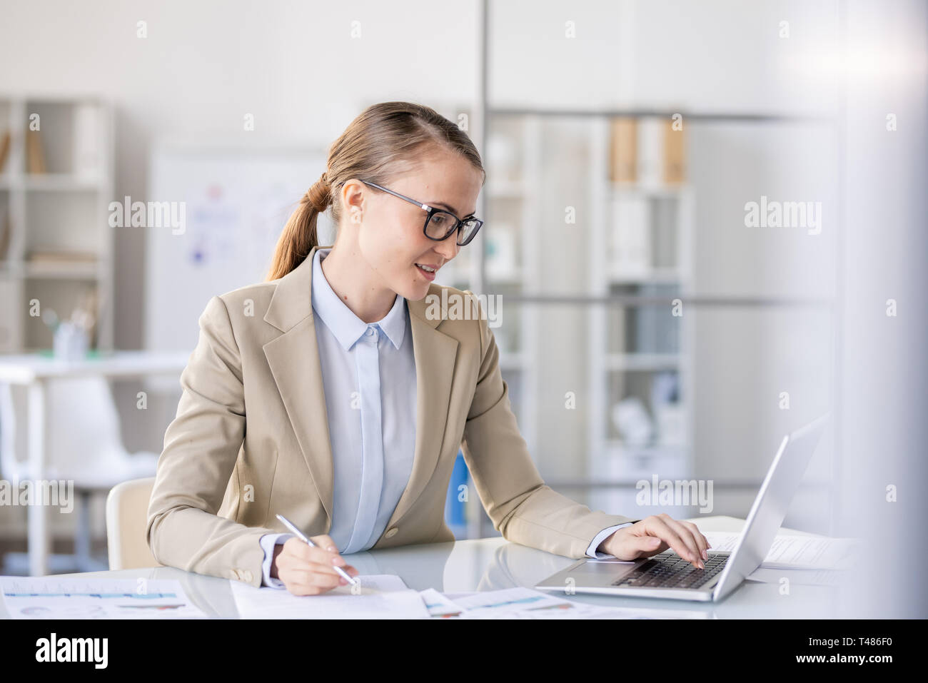 Beautiful business lady analyzing sales Stock Photo - Alamy