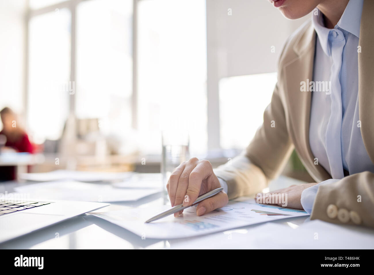 Reading report information in office Stock Photo - Alamy