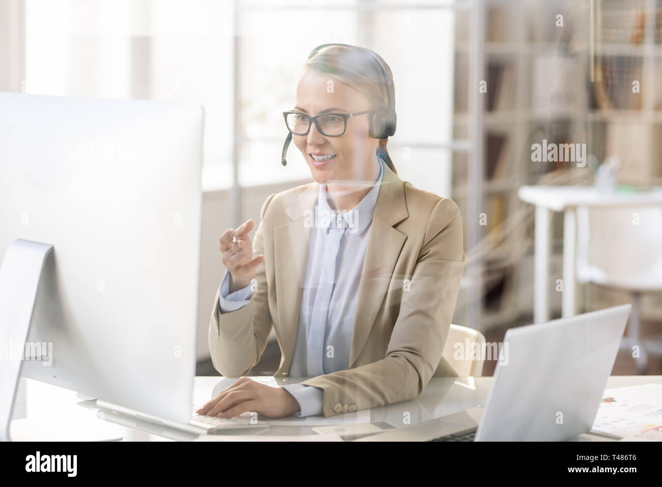 Support service operator talking to client by hands-free device Stock ...