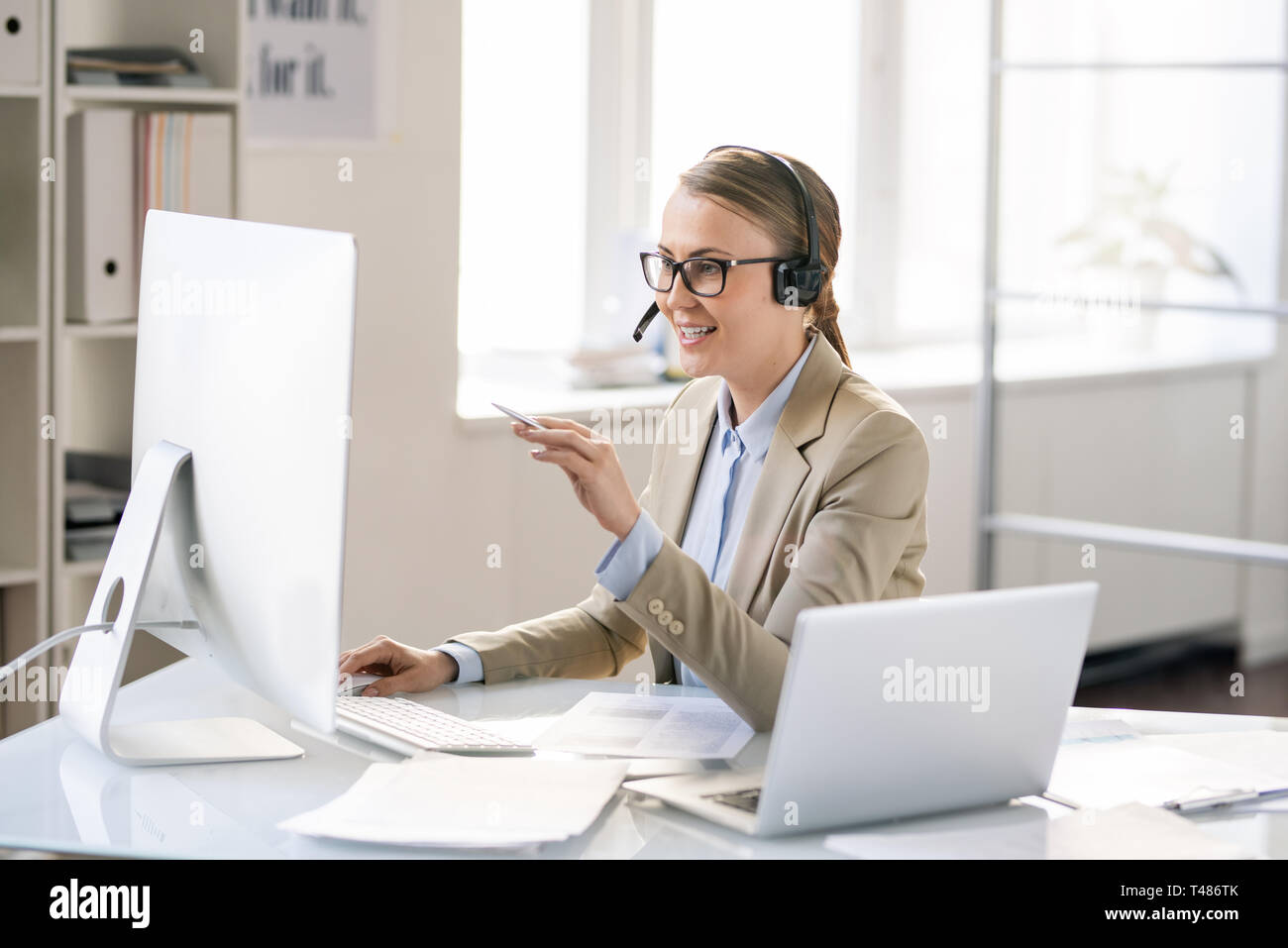 Call center representative solving technical problem of clients Stock ...