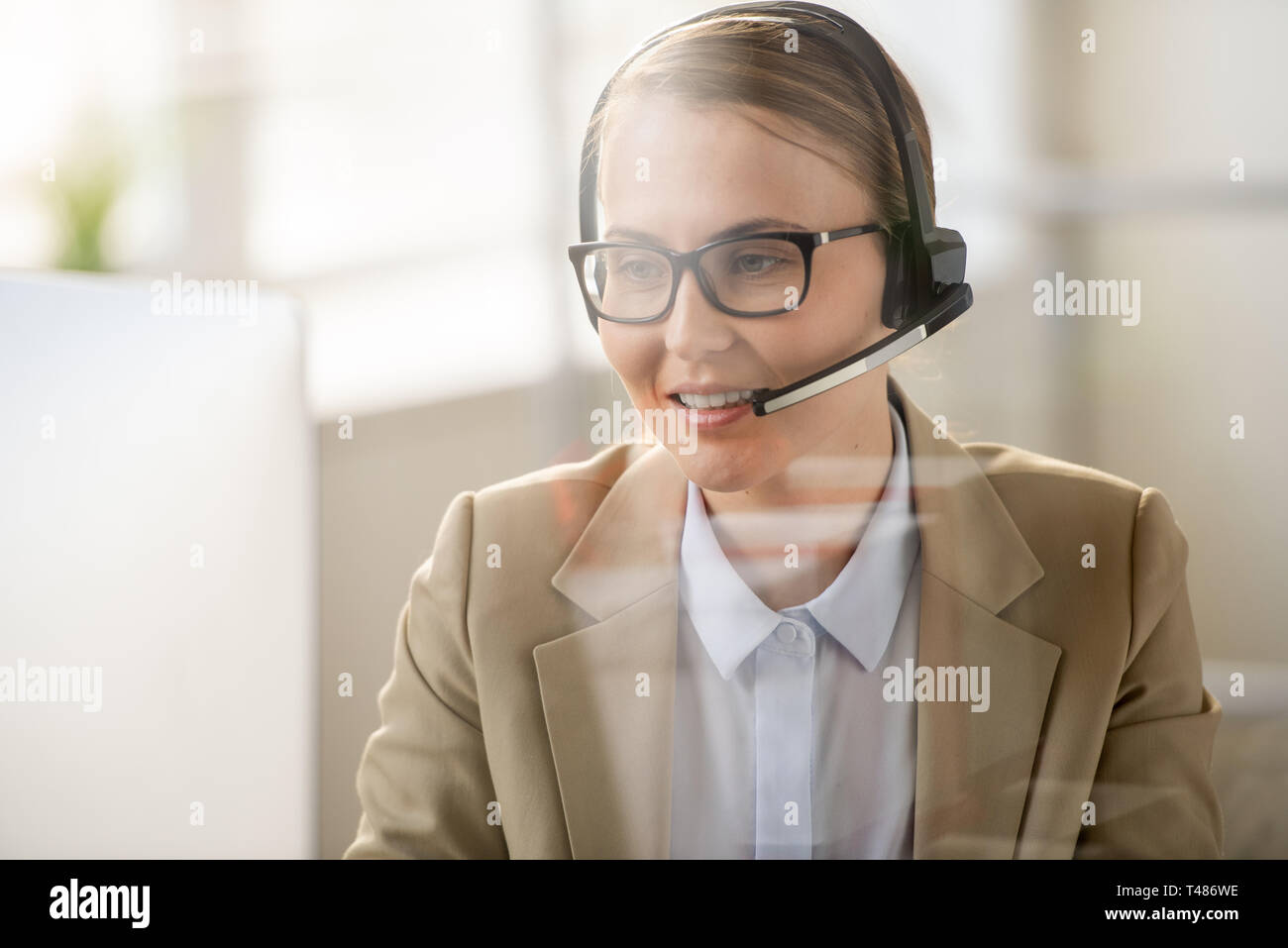 Pretty lady working at call center of programming company Stock Photo ...