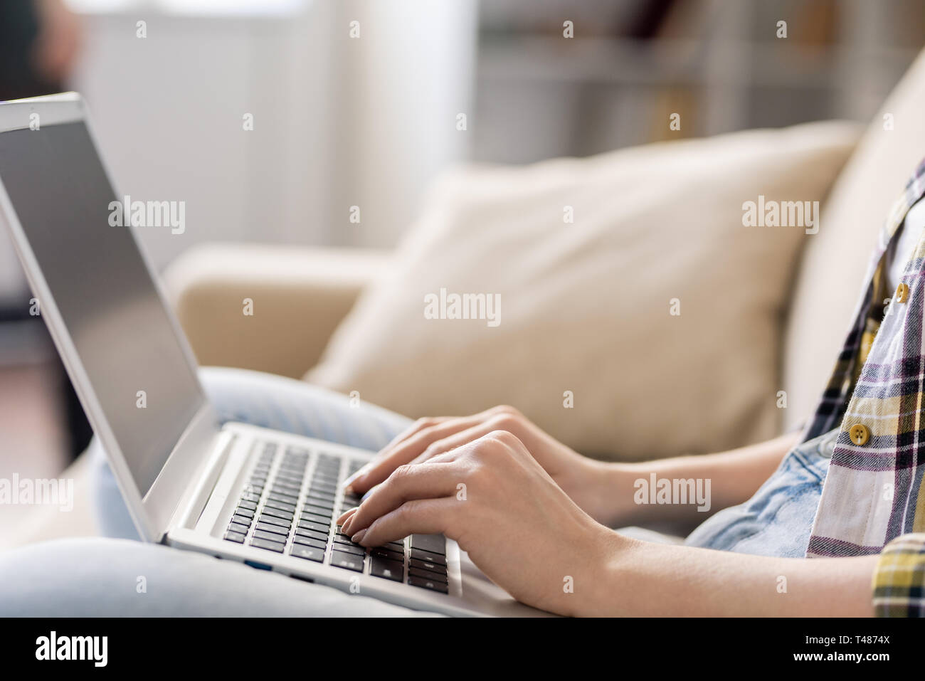 Using modern laptop at home Stock Photo - Alamy