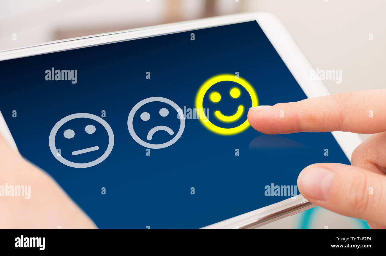 customer marking smiley face in customer satisfaction survey Stock ...