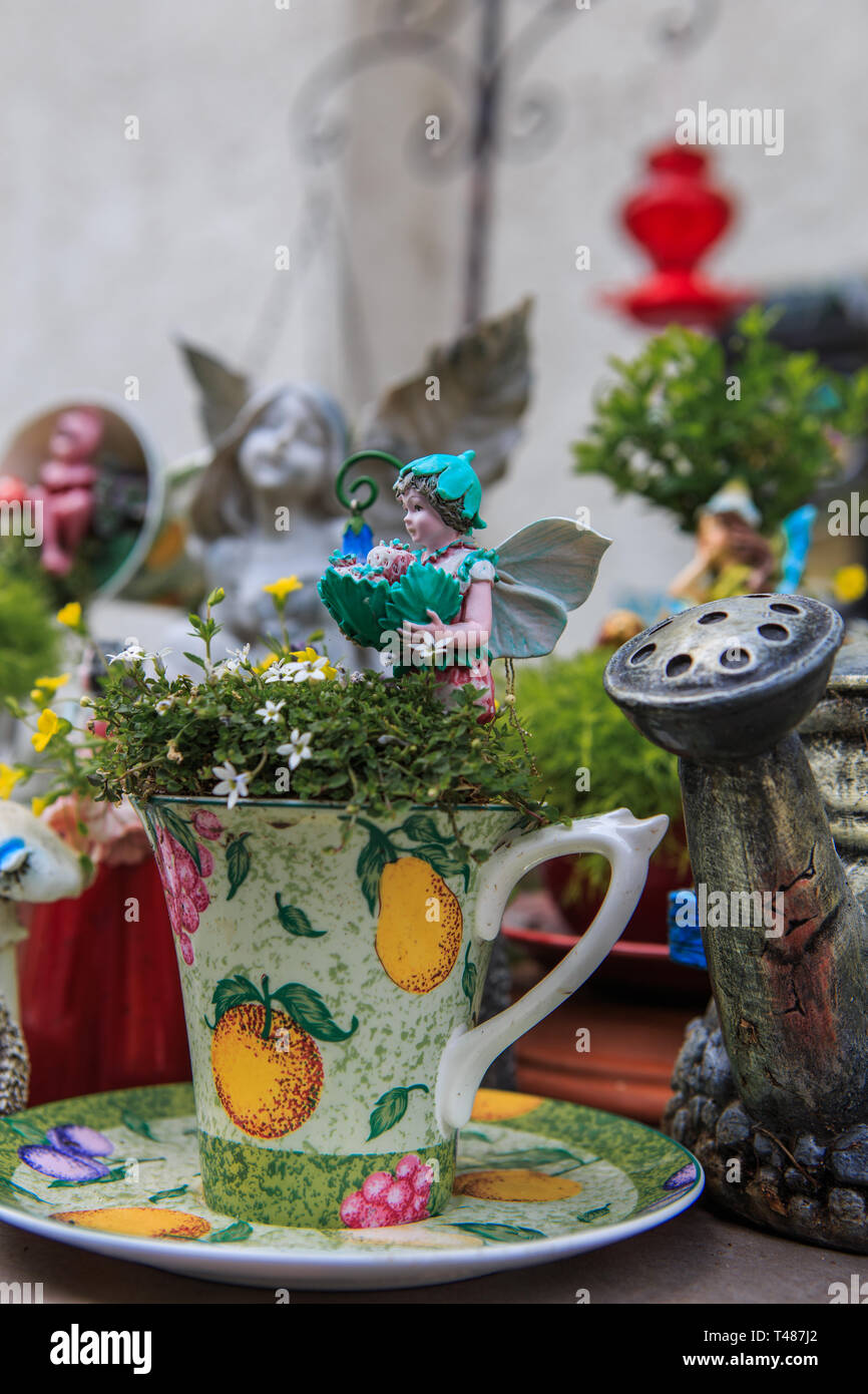 Miniature table top fairy garden with teapots and teacups used as ...