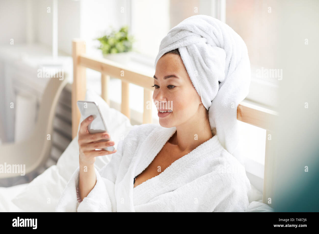Woman wearing spa robe hi-res stock photography and images - Alamy